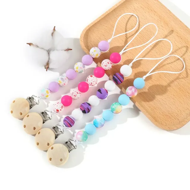 Silicone pacifier clip with coloured beads · UZO